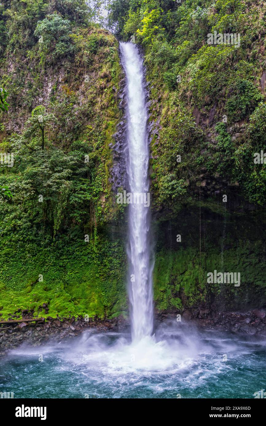 Waterfall base in rain with flowing water Stock Photo - Alamy