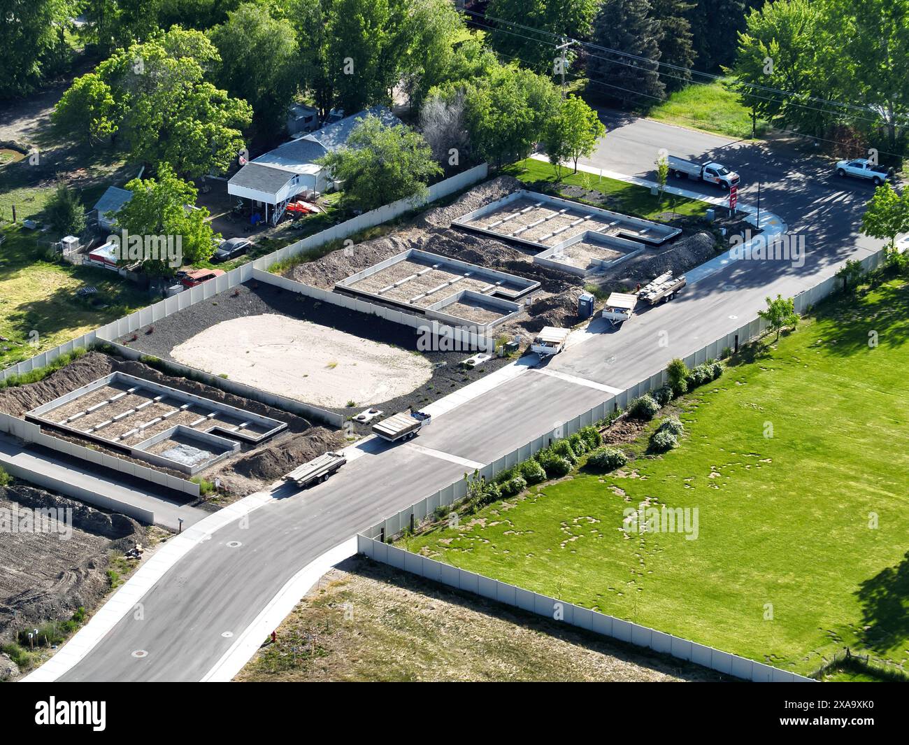 Intersection construction between roads and parking lot Stock Photo - Alamy