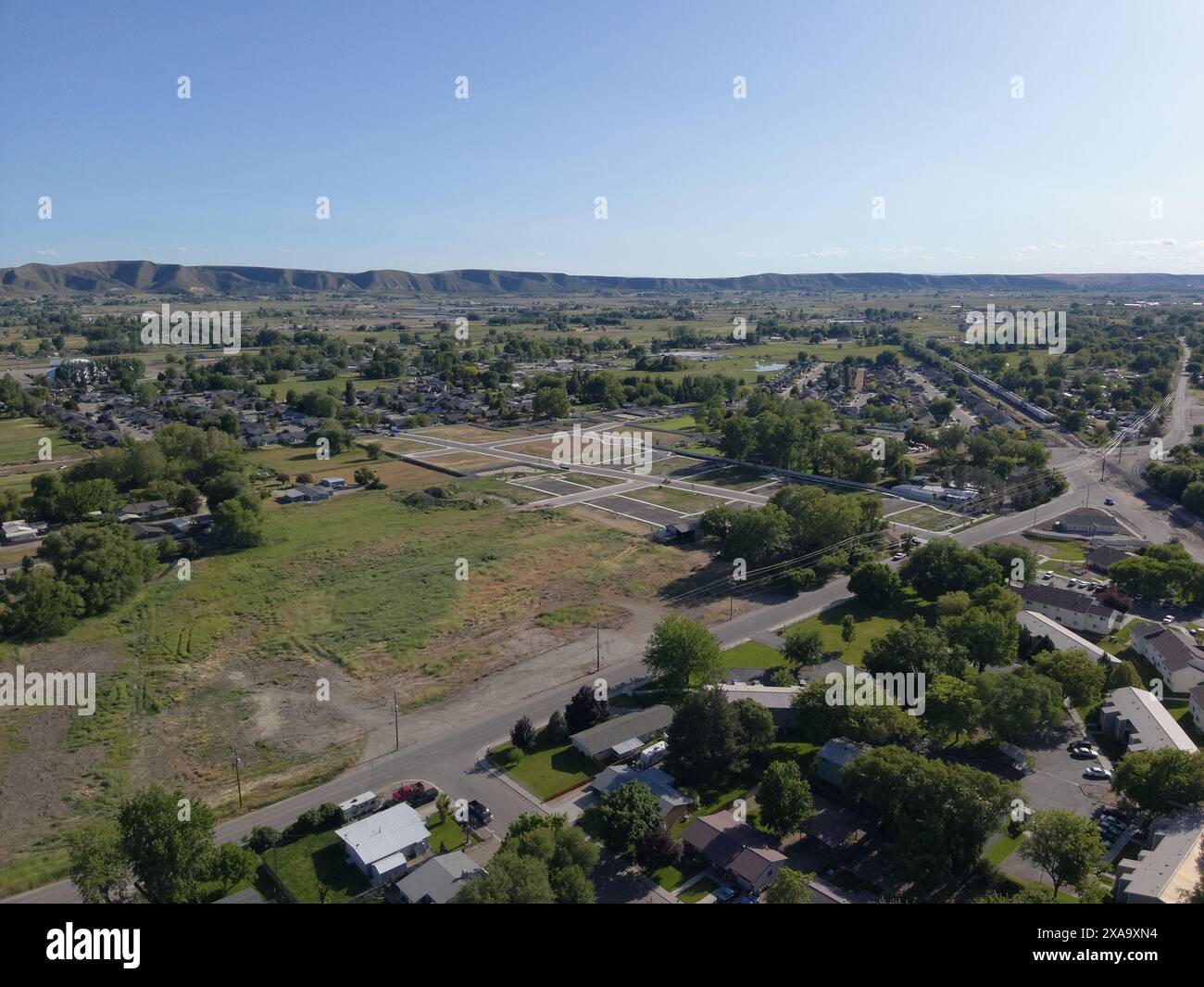 Aerial view of a town with a distant mountain Stock Photo - Alamy