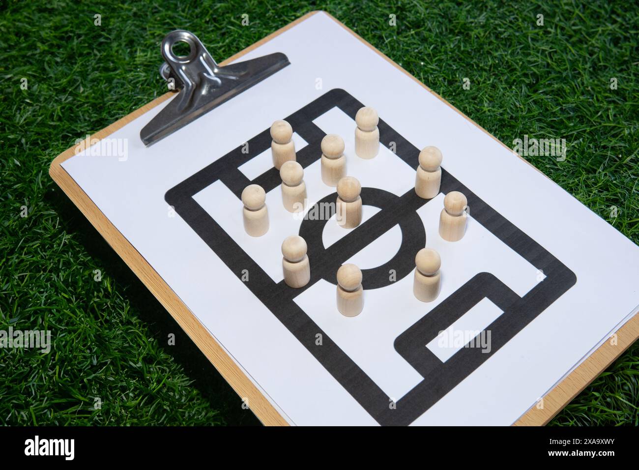 Football tactical clipboard on top of green football field. Football ...