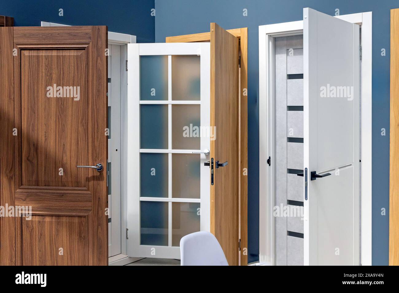 Choice of entrance doors inside show room interior Stock Photo - Alamy
