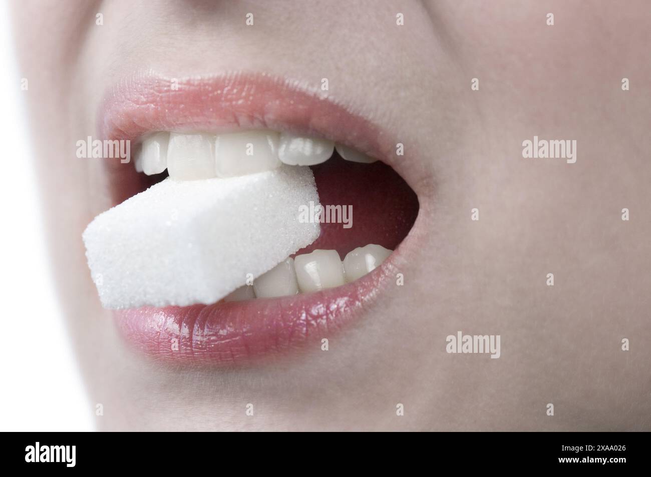 Sugar Cube woman mouth and teeth Stock Photo - Alamy