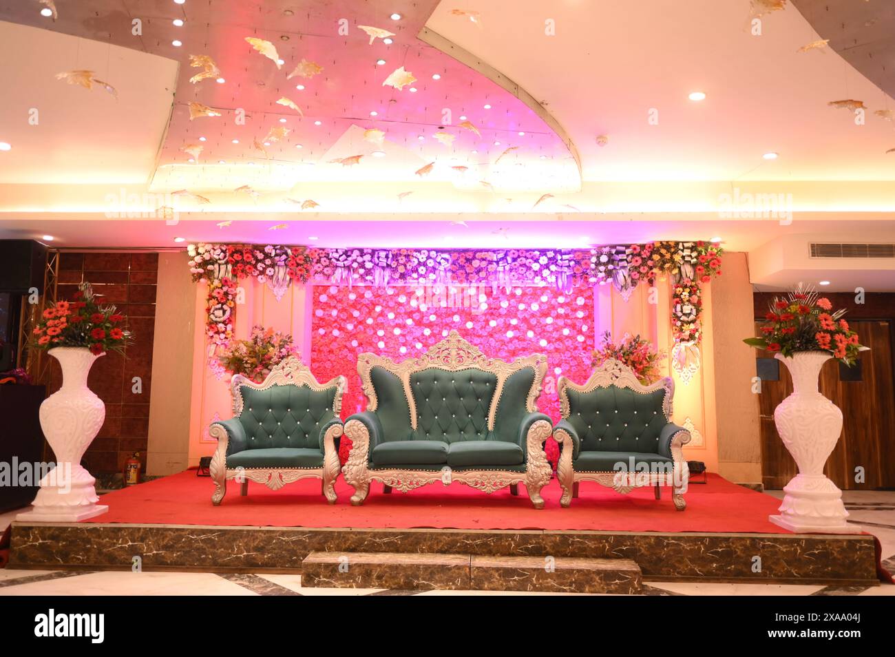 Banquet stage with table and chairs Stock Photo - Alamy