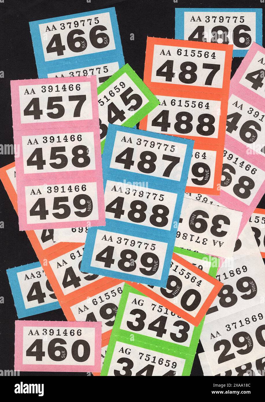 A montage of vintage raffle tickets isolated on a black background ...