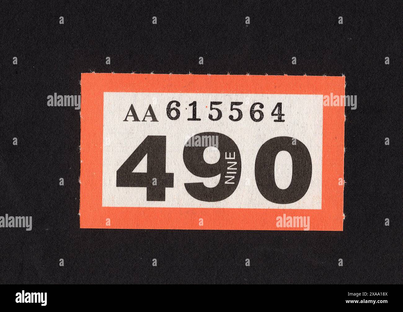 A vintage raffle ticket isolated on a black background Stock Photo - Alamy