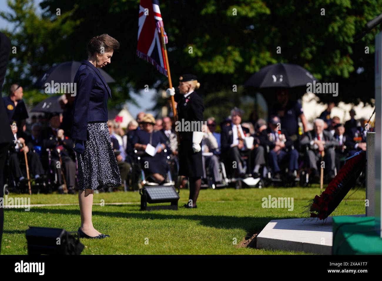 The Princess Royal bows her head as a mark of respect after laying a ...