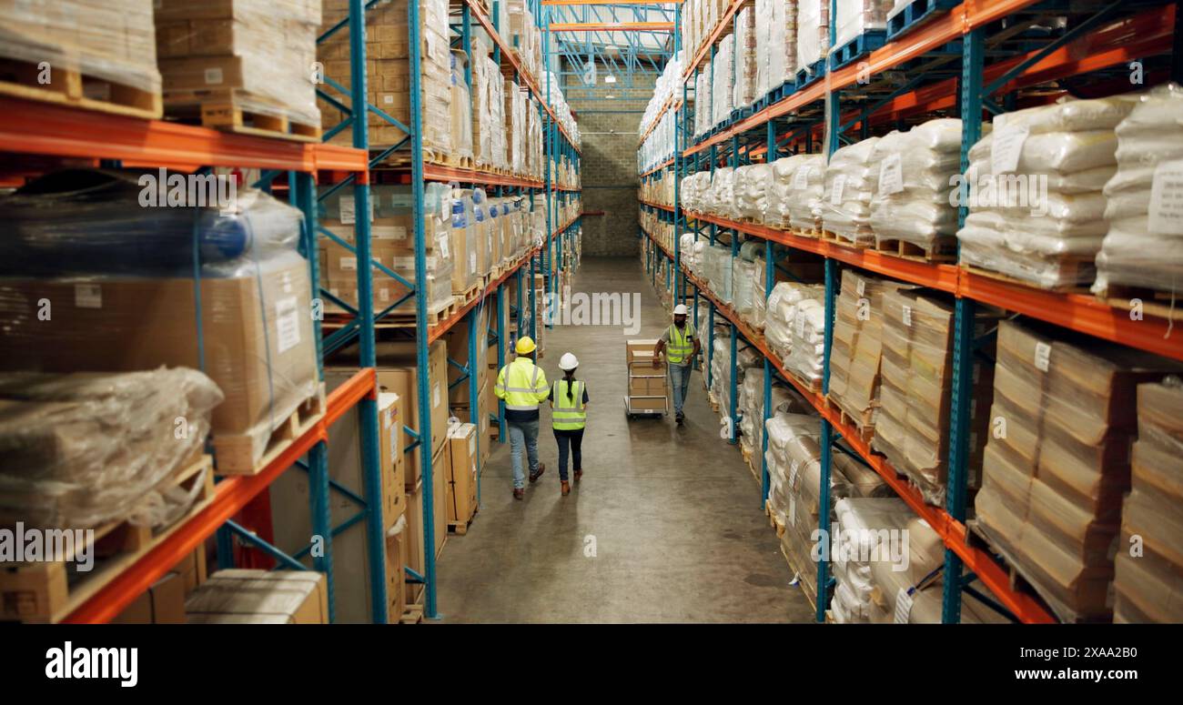 Warehouse, shipping and delivery people walking in a distribution ...