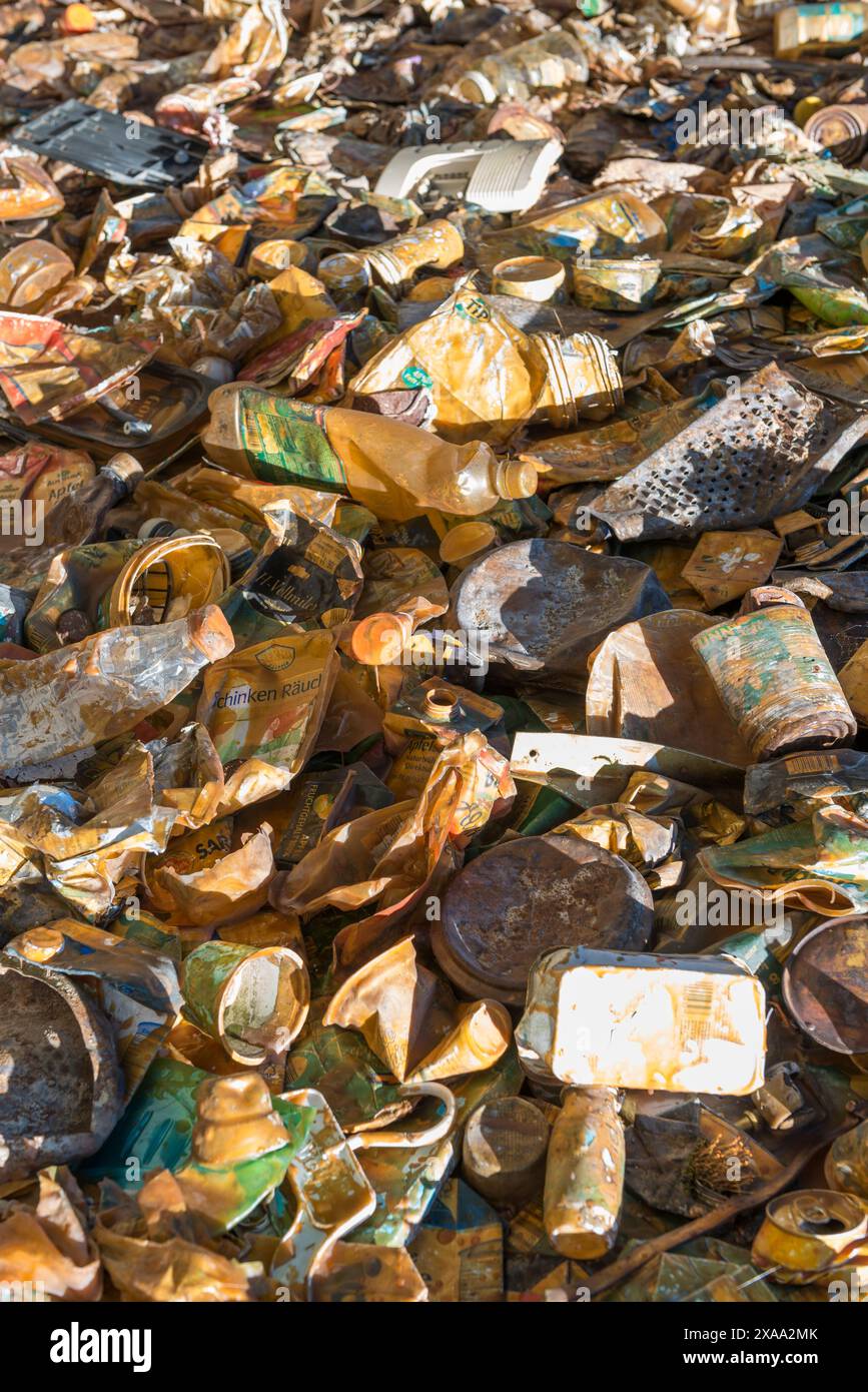Waste being dumped and covered with plastic items Stock Photo - Alamy