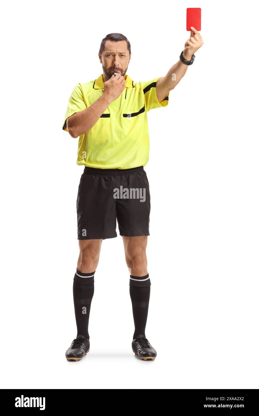 Full length portrait of a football referee holding a whistle and ...