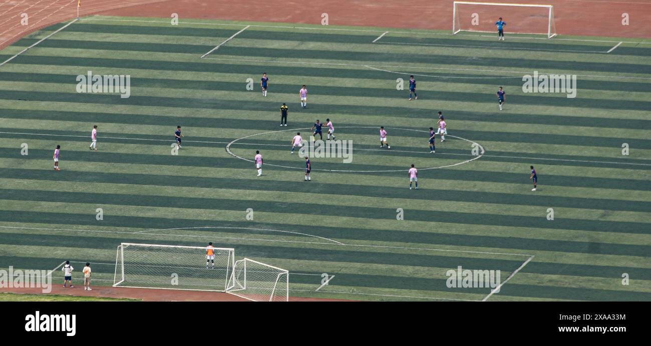On the football field of a university in Wuhan, two student football ...