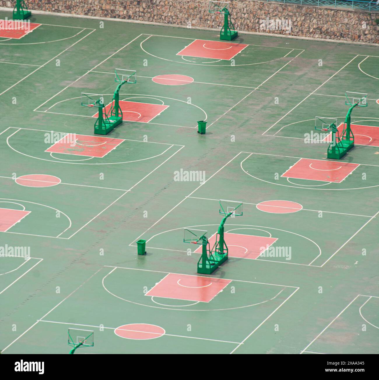 The open basketball court of a university in Wuhan. A few students ...