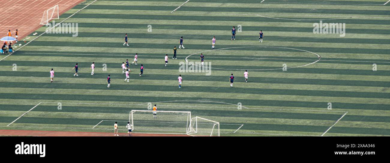 On the football field of a university in Wuhan, two student football ...