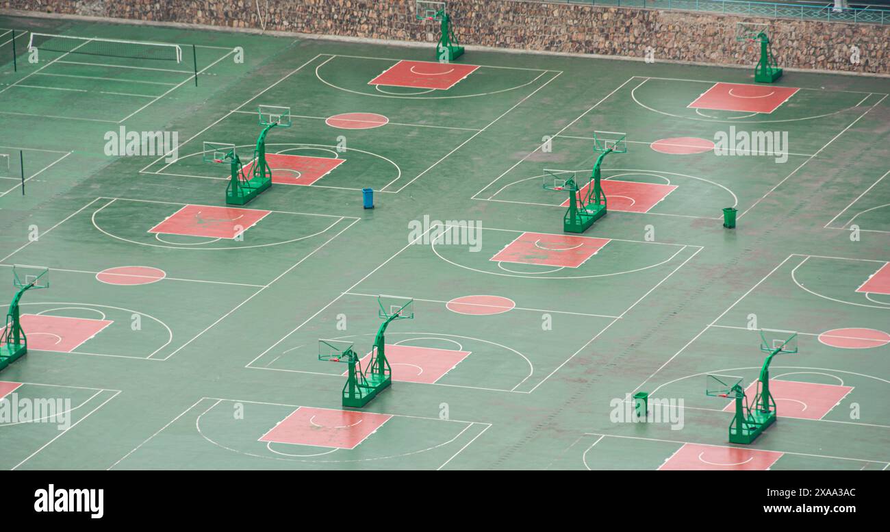 The open basketball court of a university in Wuhan. A few students ...