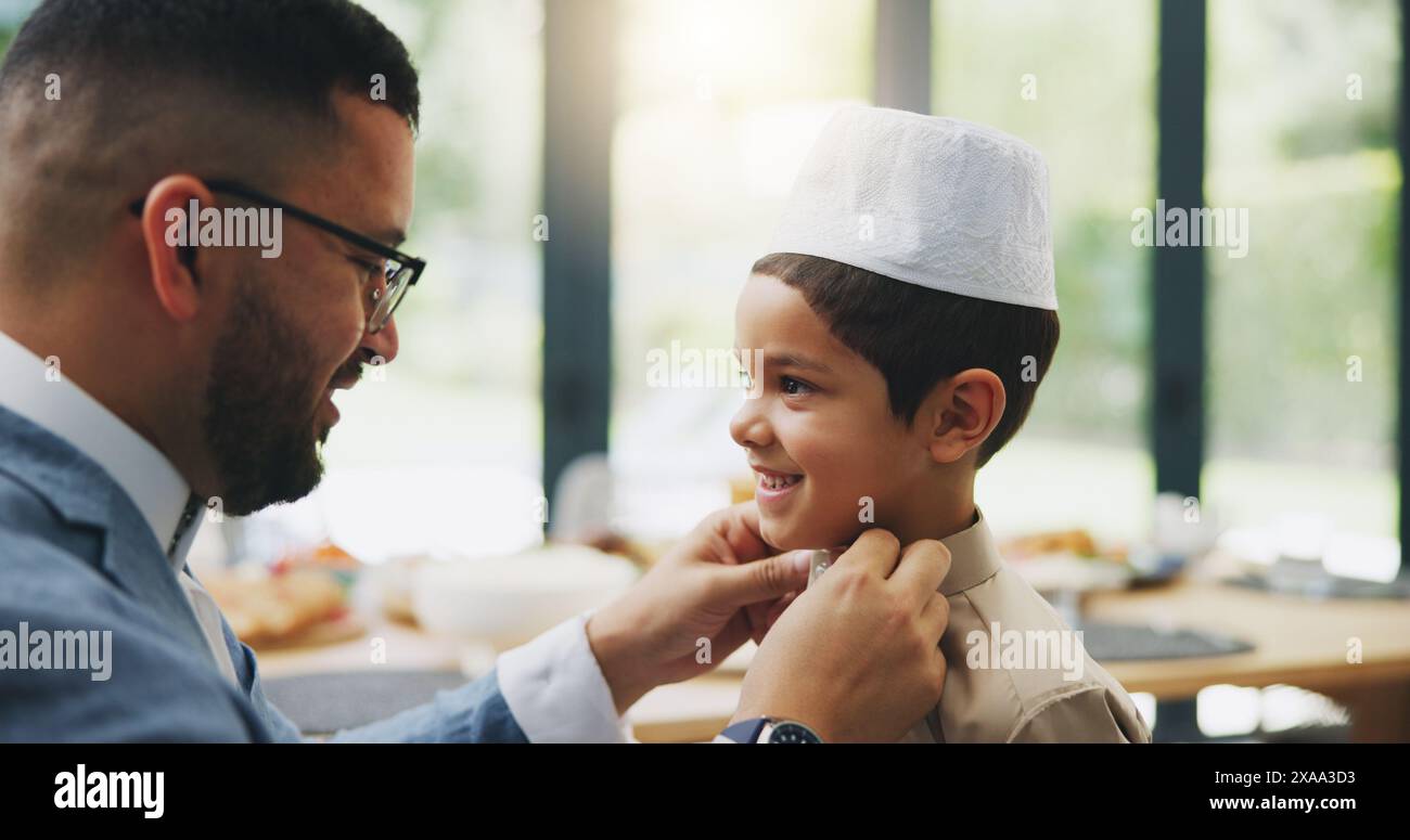 Muslim, dad and dressing of child in home, celebration and holiday of ...