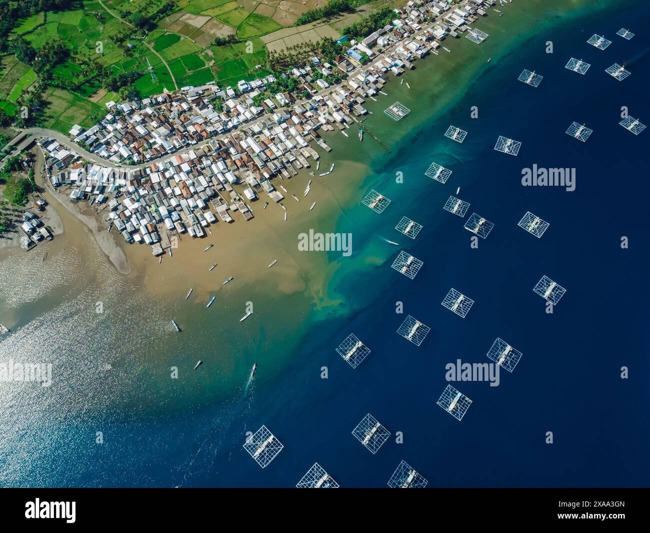 Fishing town and fishing boats in quiet ocean on Sumbawa island. Scenic ...