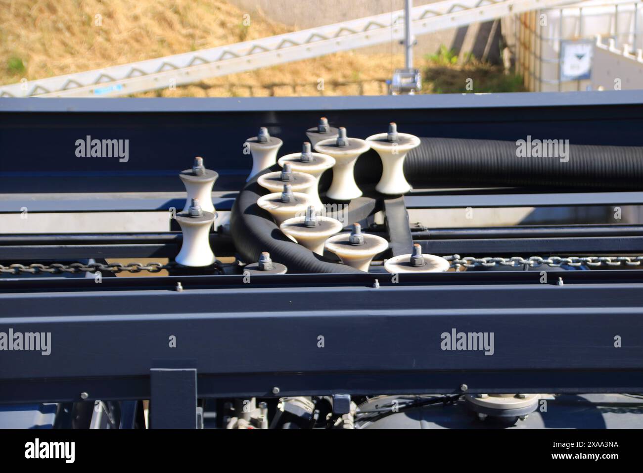 Deflection rollers on a roof of a vacuum truck Stock Photo - Alamy