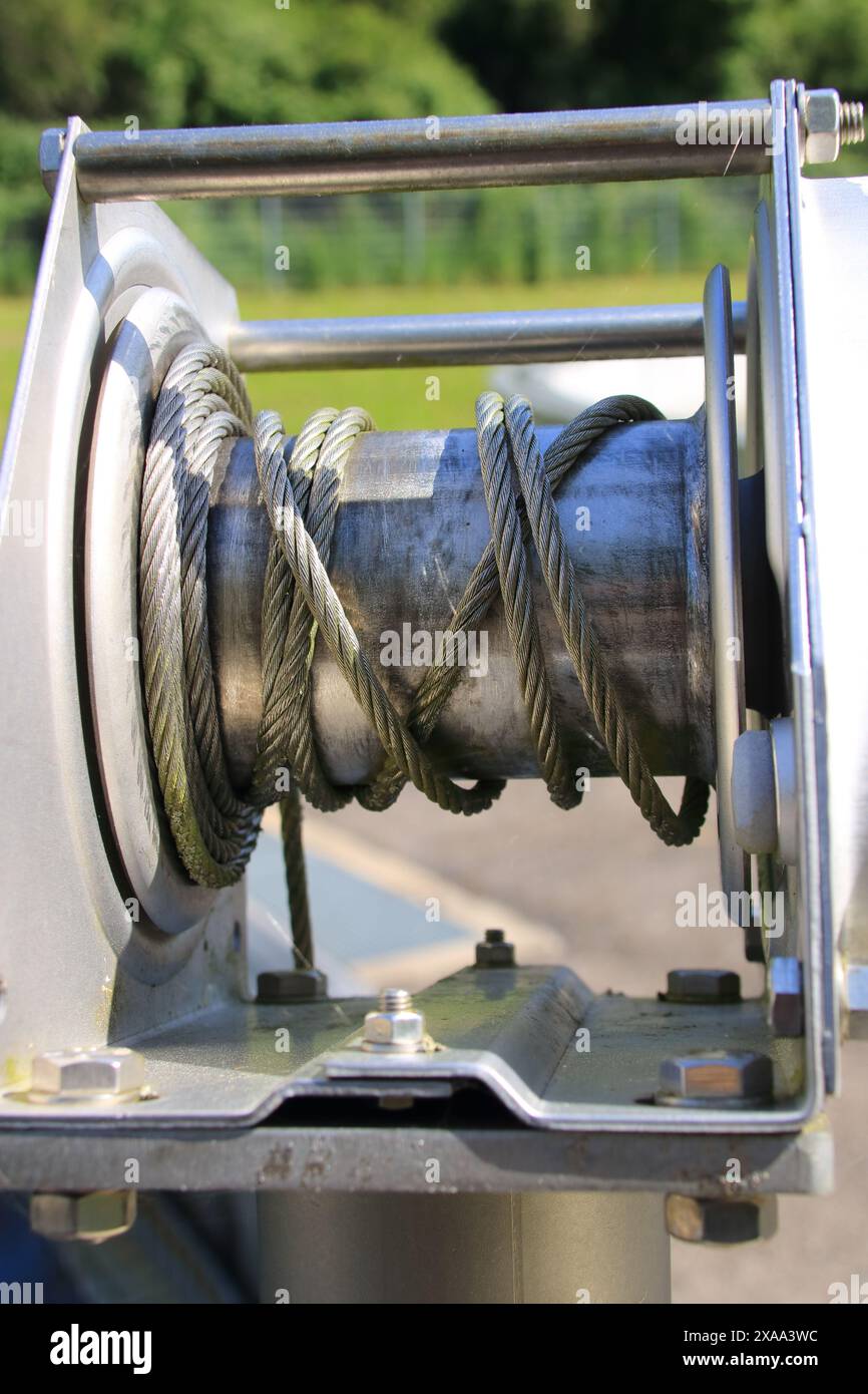 Wire rope from a winch is wound up in a mess Stock Photo - Alamy