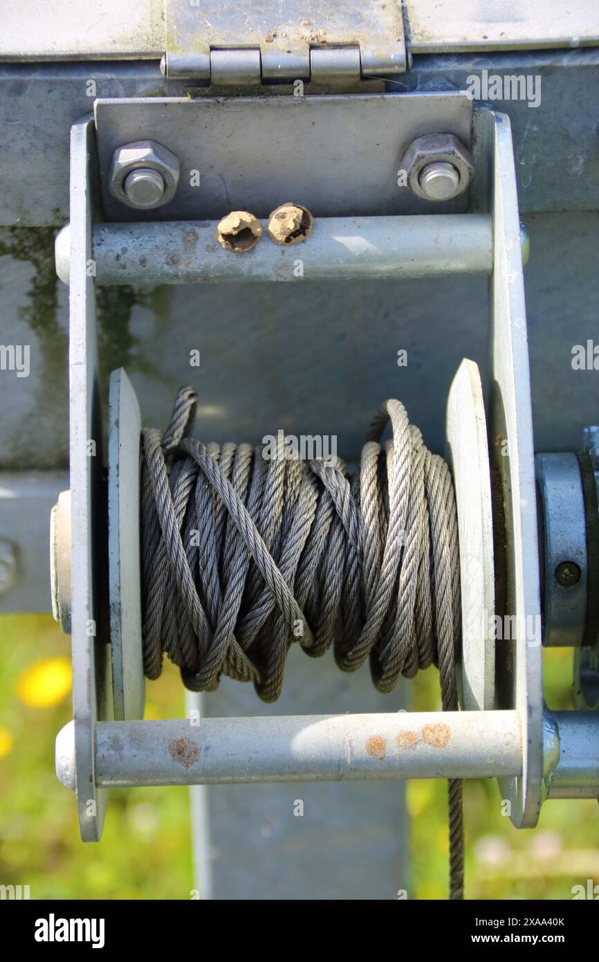 Wire rope from a winch is wound up in a mess Stock Photo - Alamy