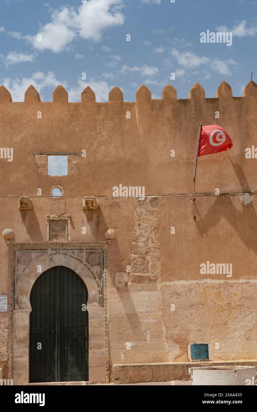 The Tunisian national flag flying from inside the ancient city walls of ...