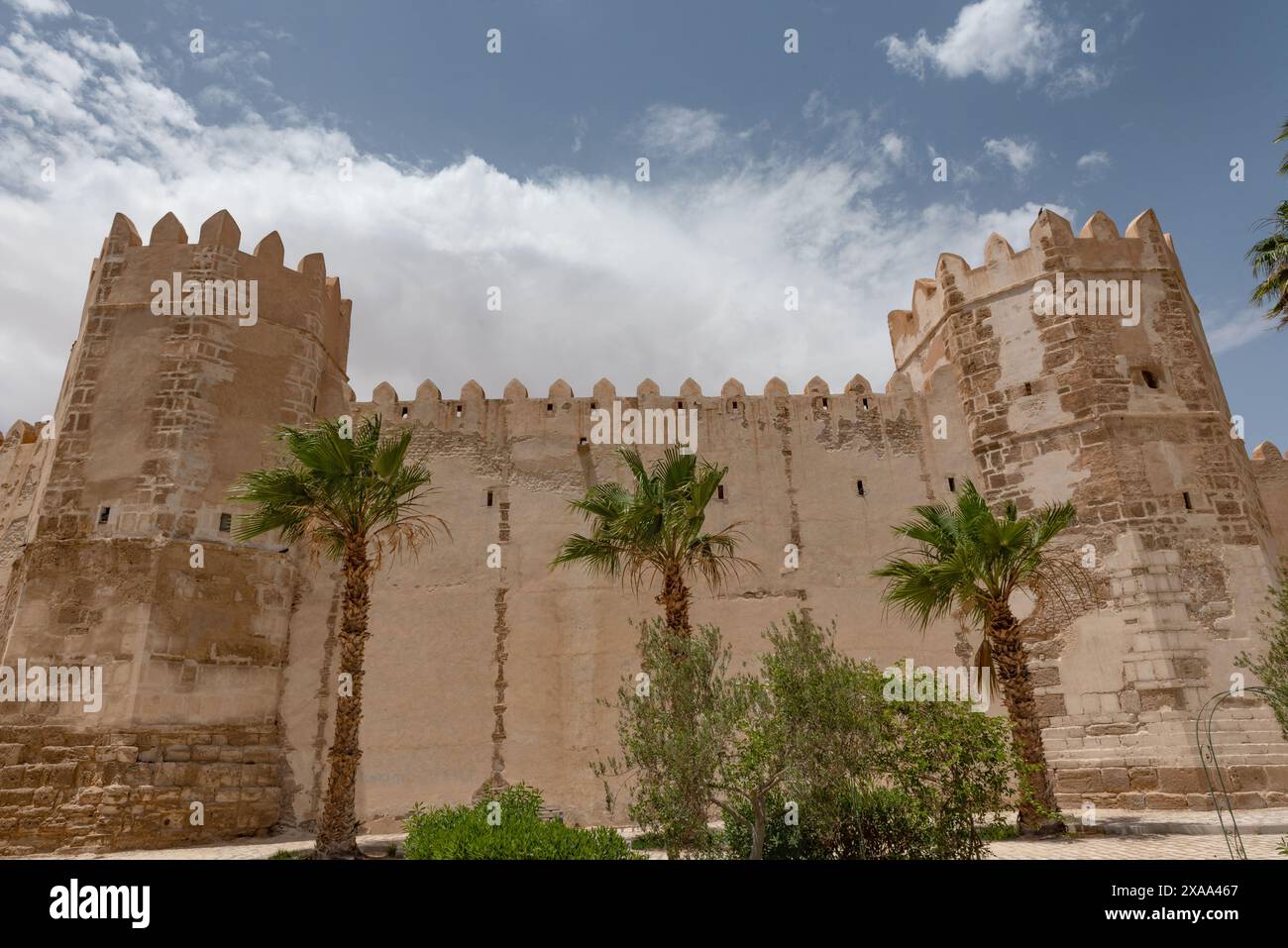 Tower and details of the ancient city walls of the medieval Medina of Sfax on the Mediterranean ...