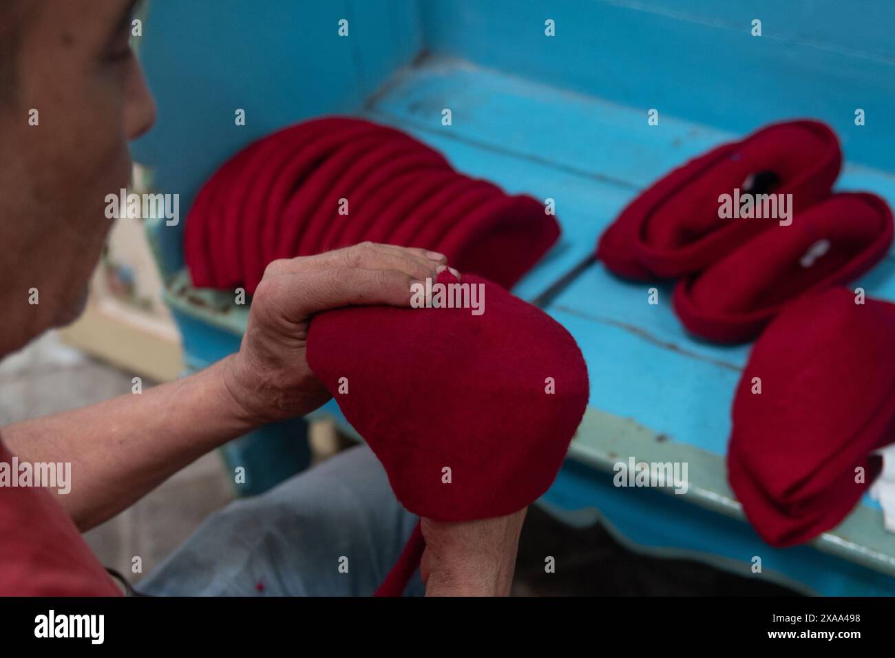 Tunis, Tunisia 22nd May, 2024 A Tunisian artisan puts the finishing ...