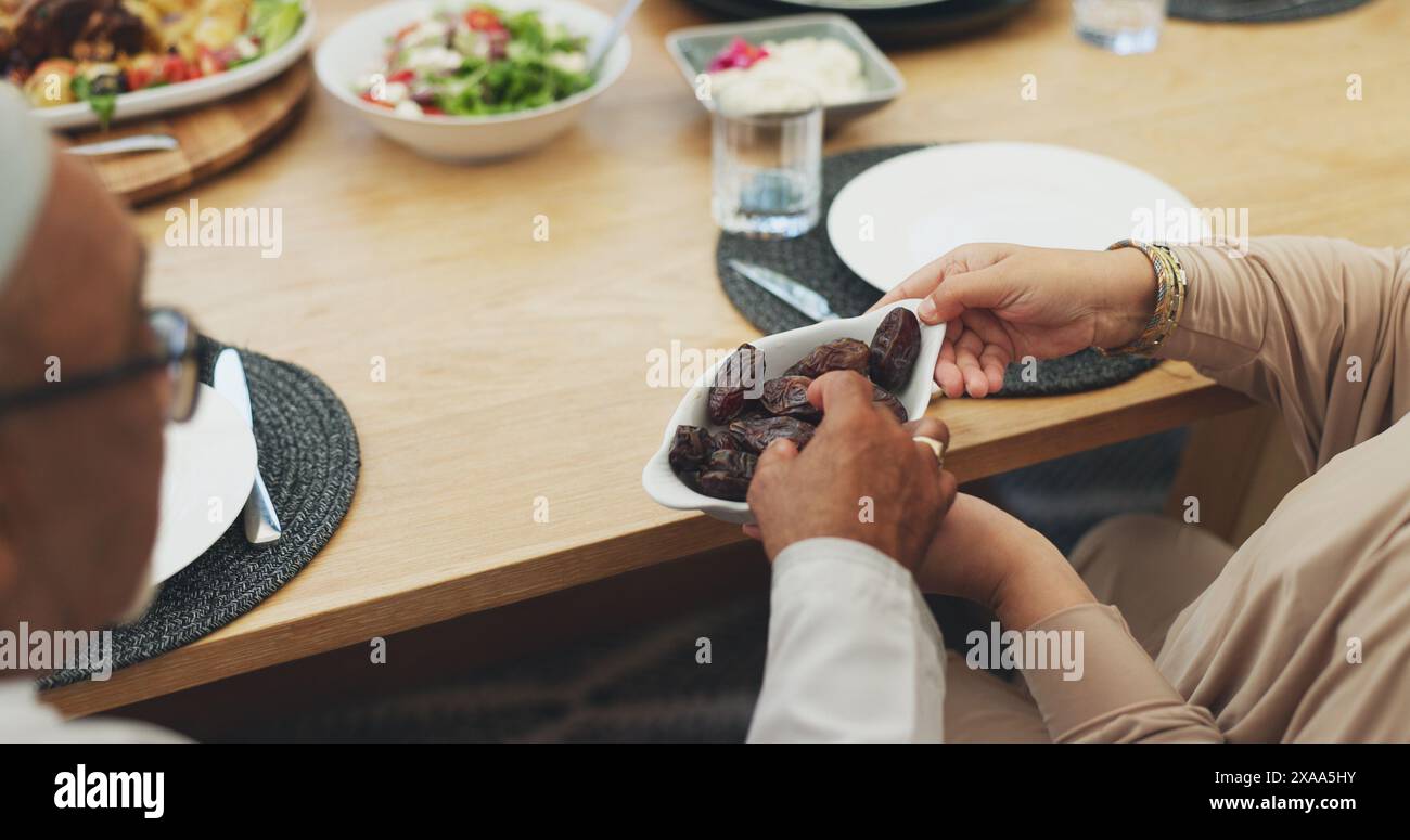 Hands, lunch and eating dates for Iftar, ramadan and people breaking ...