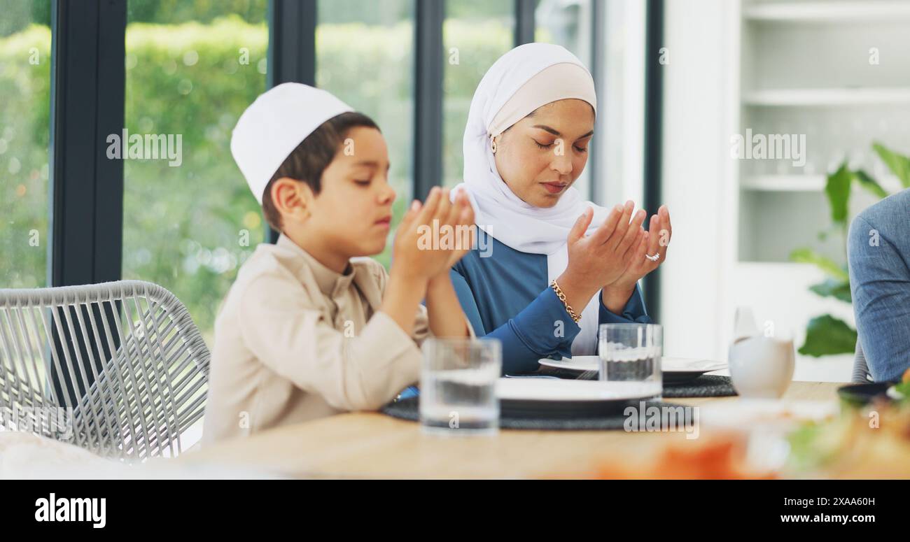 Mother, praying and Muslim family with food to say prayer or dua before ...