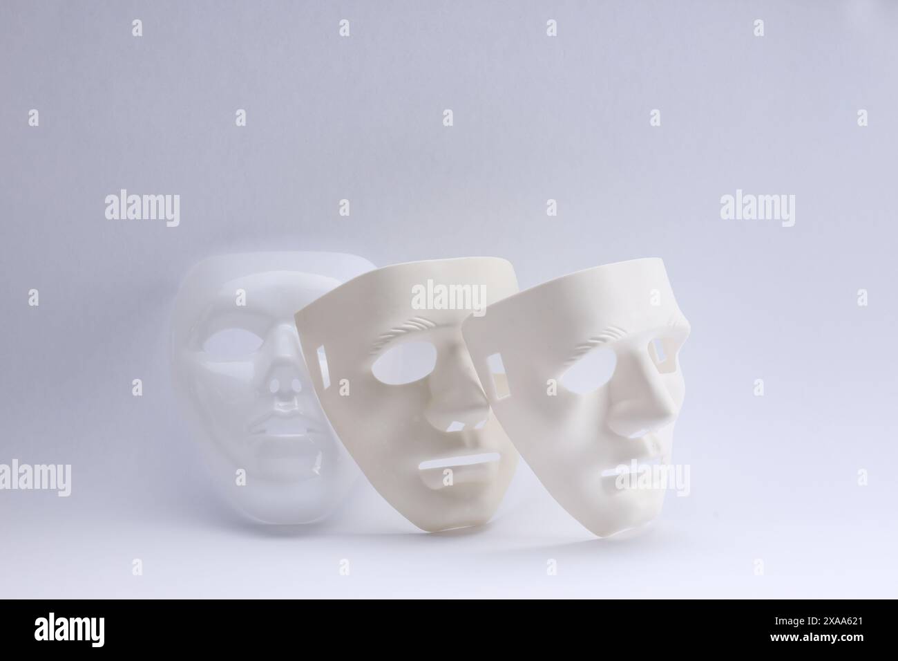 Plastic face masks on white background. Theatrical performance Stock ...