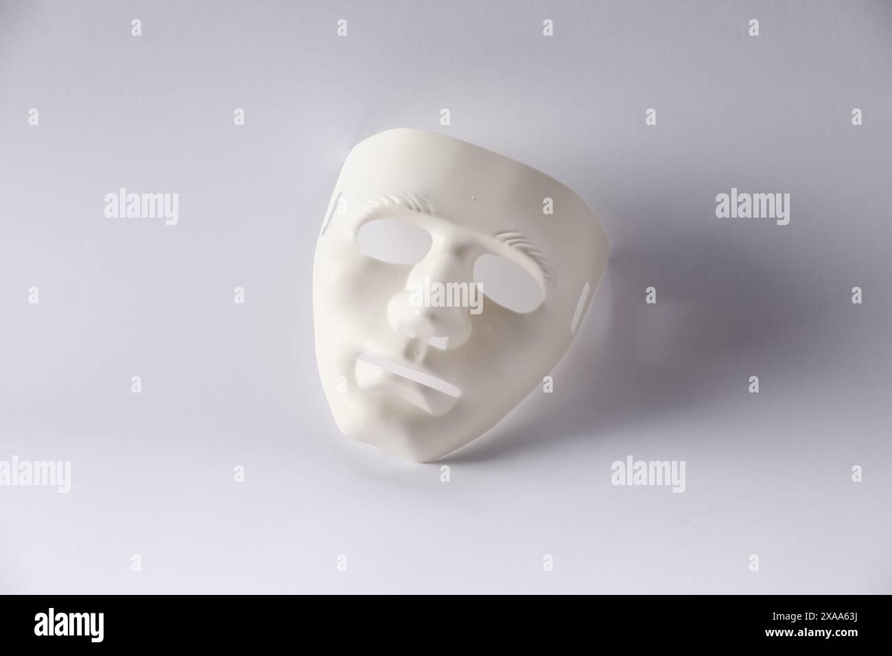 Plastic face mask on white background. Theatrical performance Stock ...