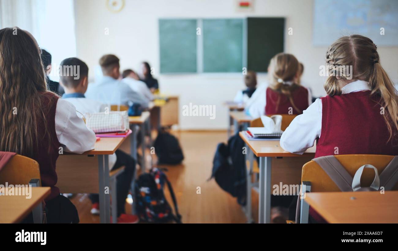 A junior high school class in a middle school. Back view Stock Photo ...