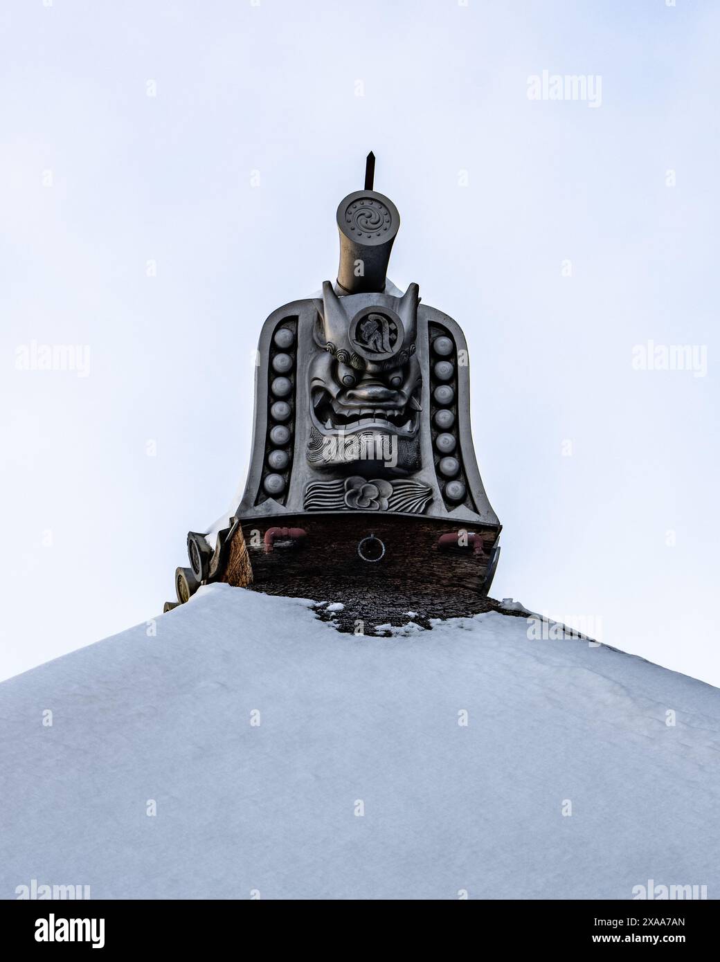 The Snow covered Ogre Goblin Onigawara statue on the rooftop at a ...