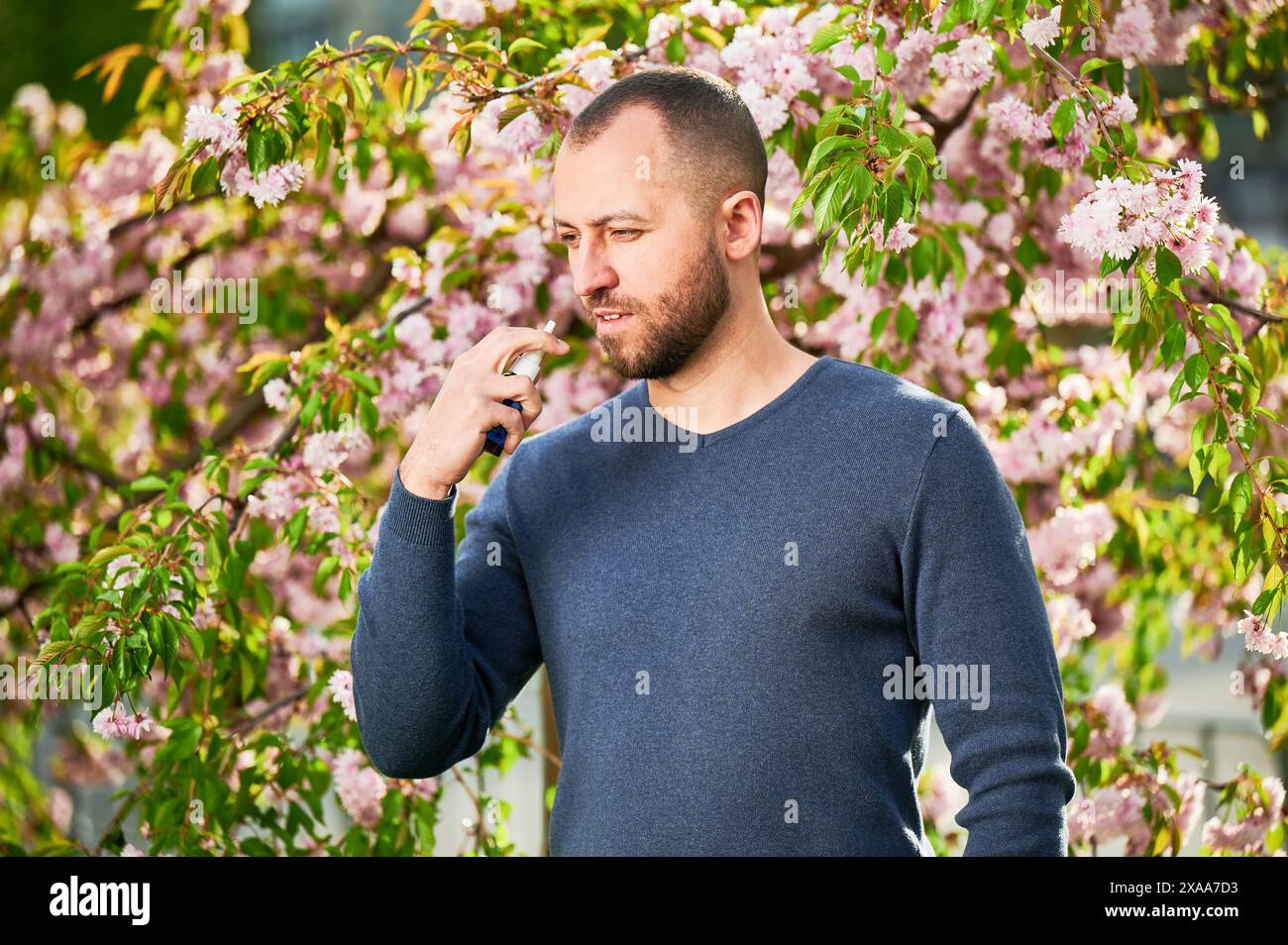 Man allergic using medical nasal spray, suffering from seasonal allergy ...