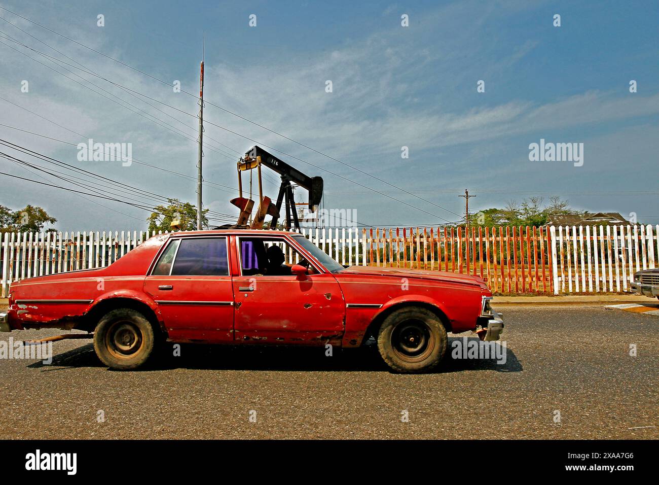 Lake Maracaibo, Venezuela. 18-03-2015. An old colective car pass in ...