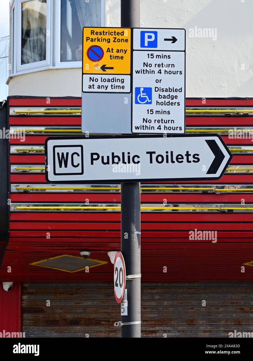 English parking regulation and rest room road sign Stock Photo - Alamy