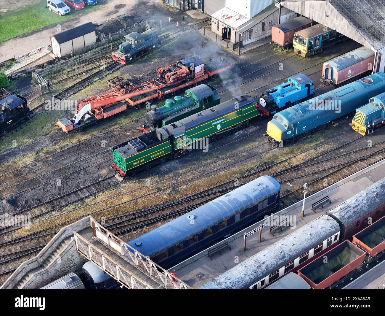 Freight trains parked near terminals on tracks Stock Photo - Alamy