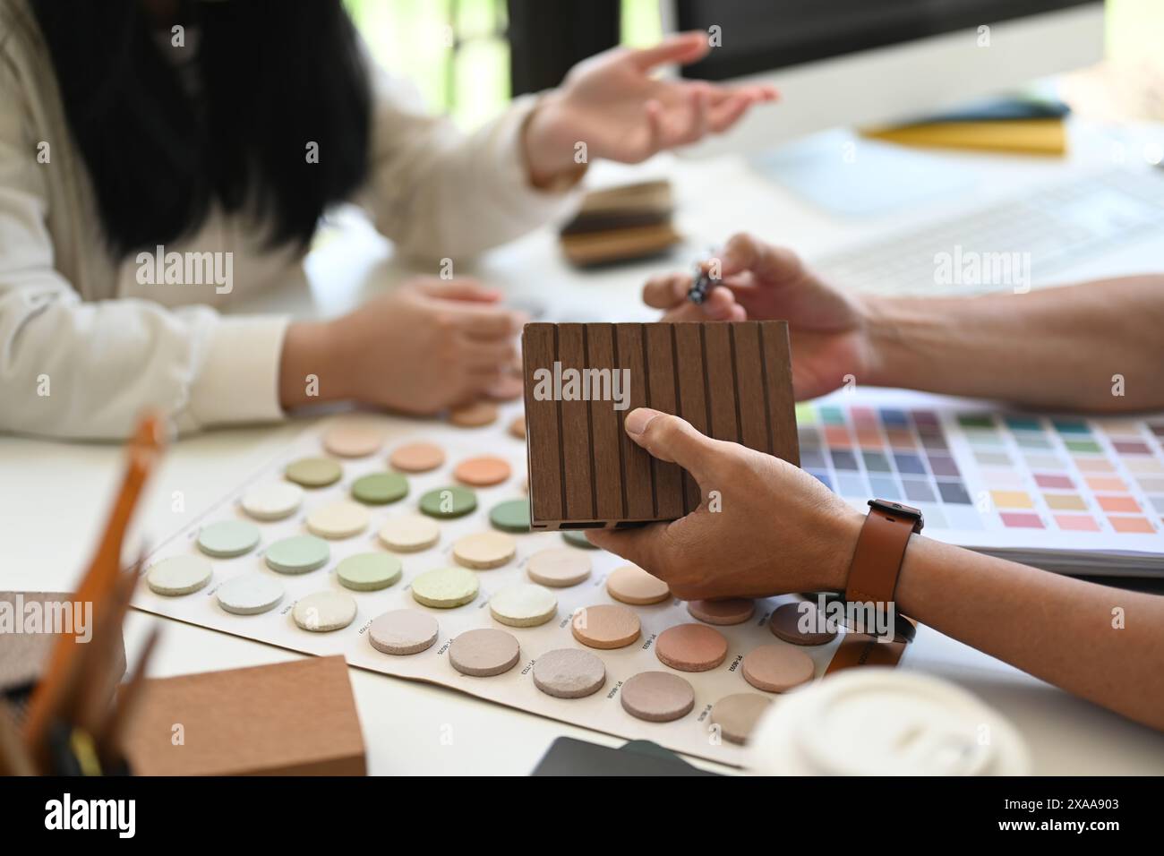 Interior designer helping client choosing colors and materials for home ...