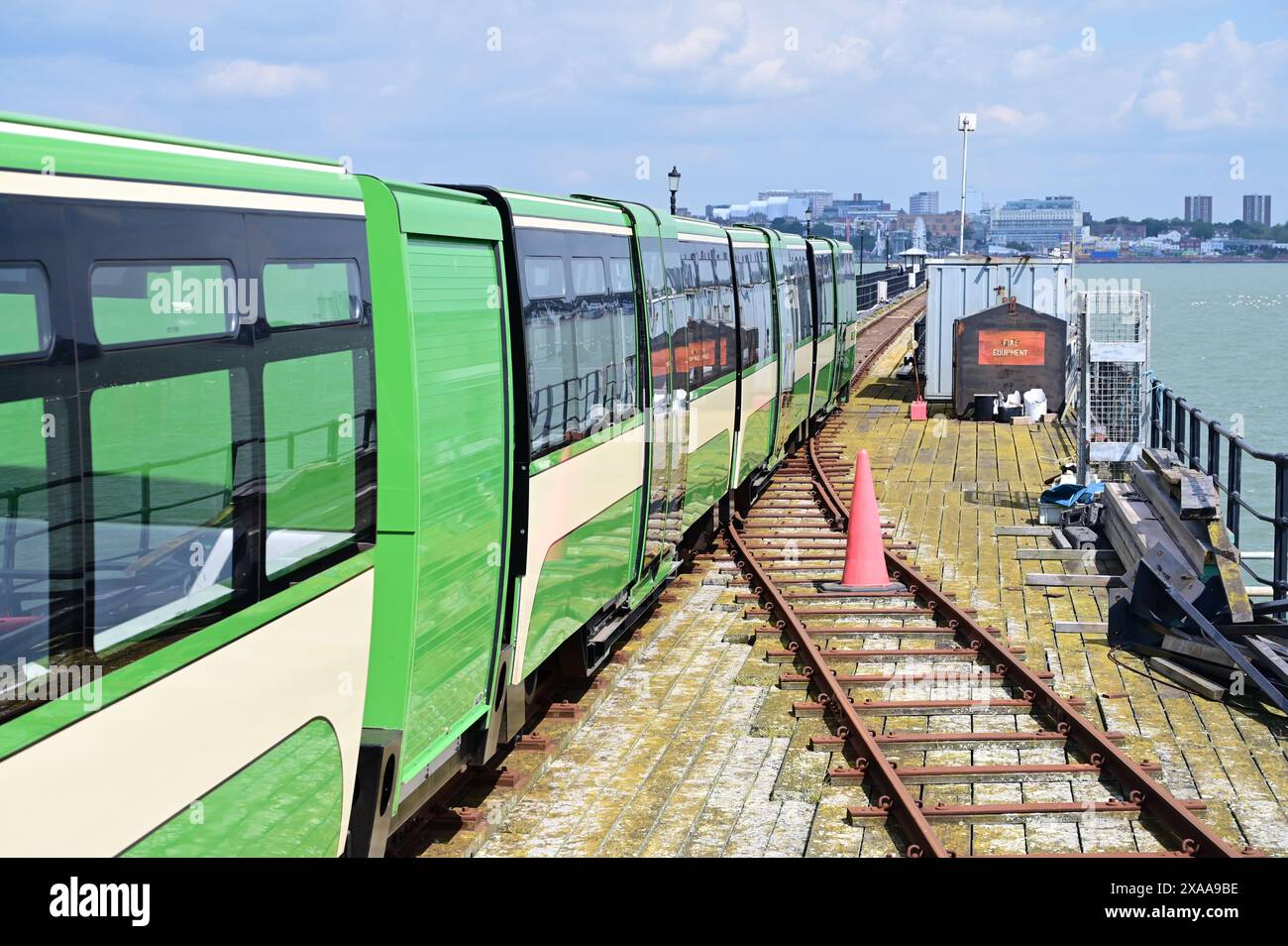 A Train leaving the station at the head of a Pier in the UK Stock Photo ...