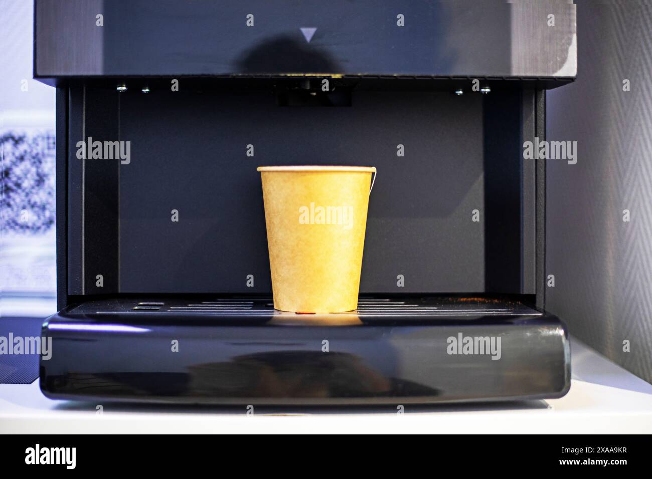 vending machine with a disposable, recyclable cardboard cup containing ...