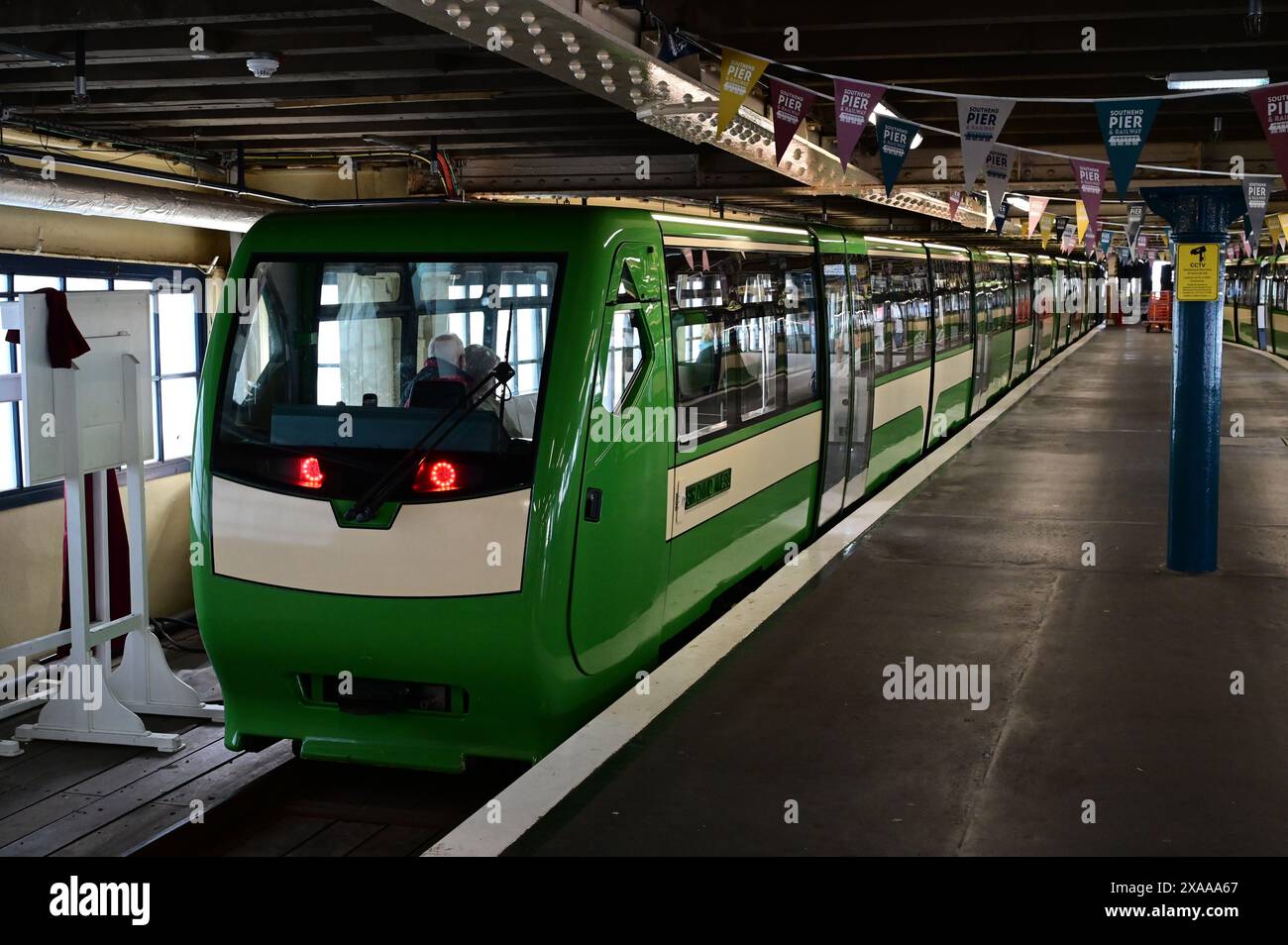 Train departing a pier train station in the UK Stock Photo - Alamy