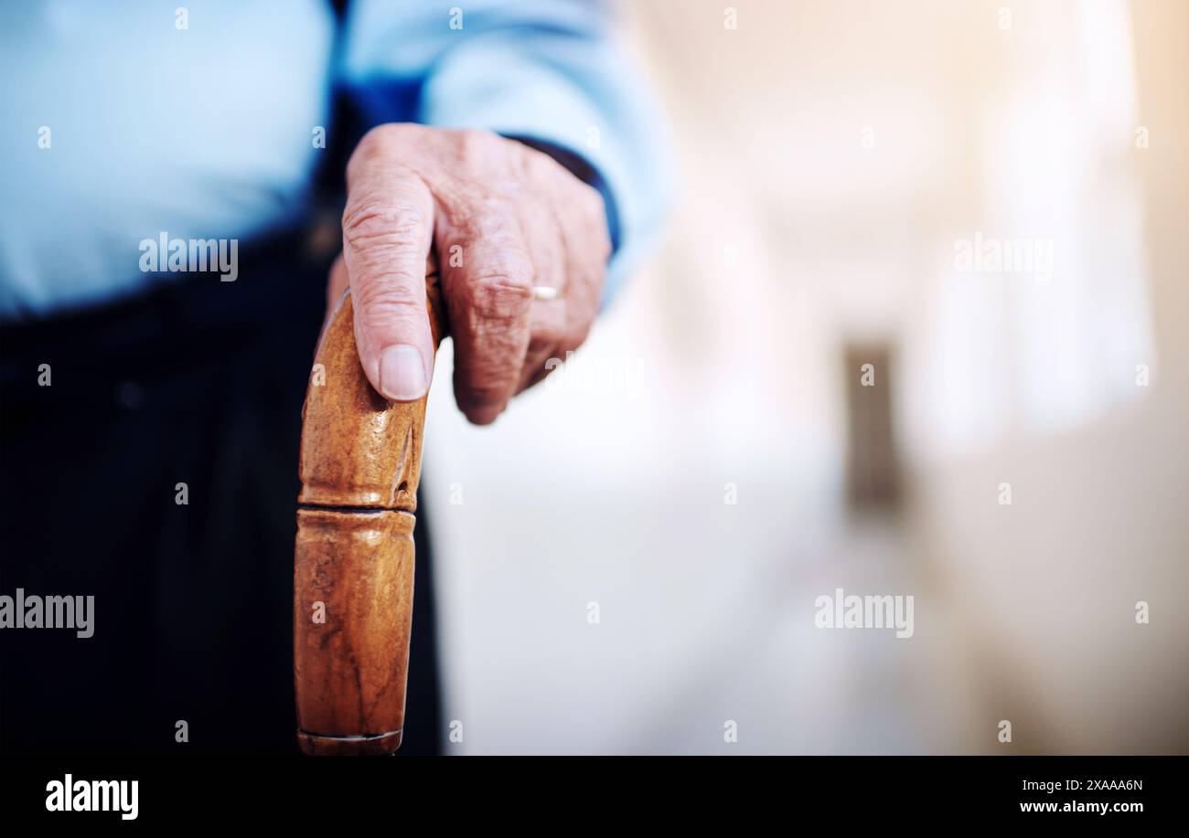 Retirement, hand and senior person with cane in closeup for balance ...