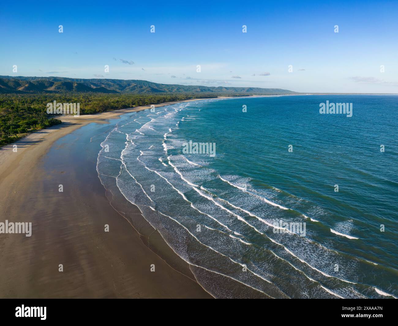 High tide waves crashing on the beach bay Stock Photo - Alamy