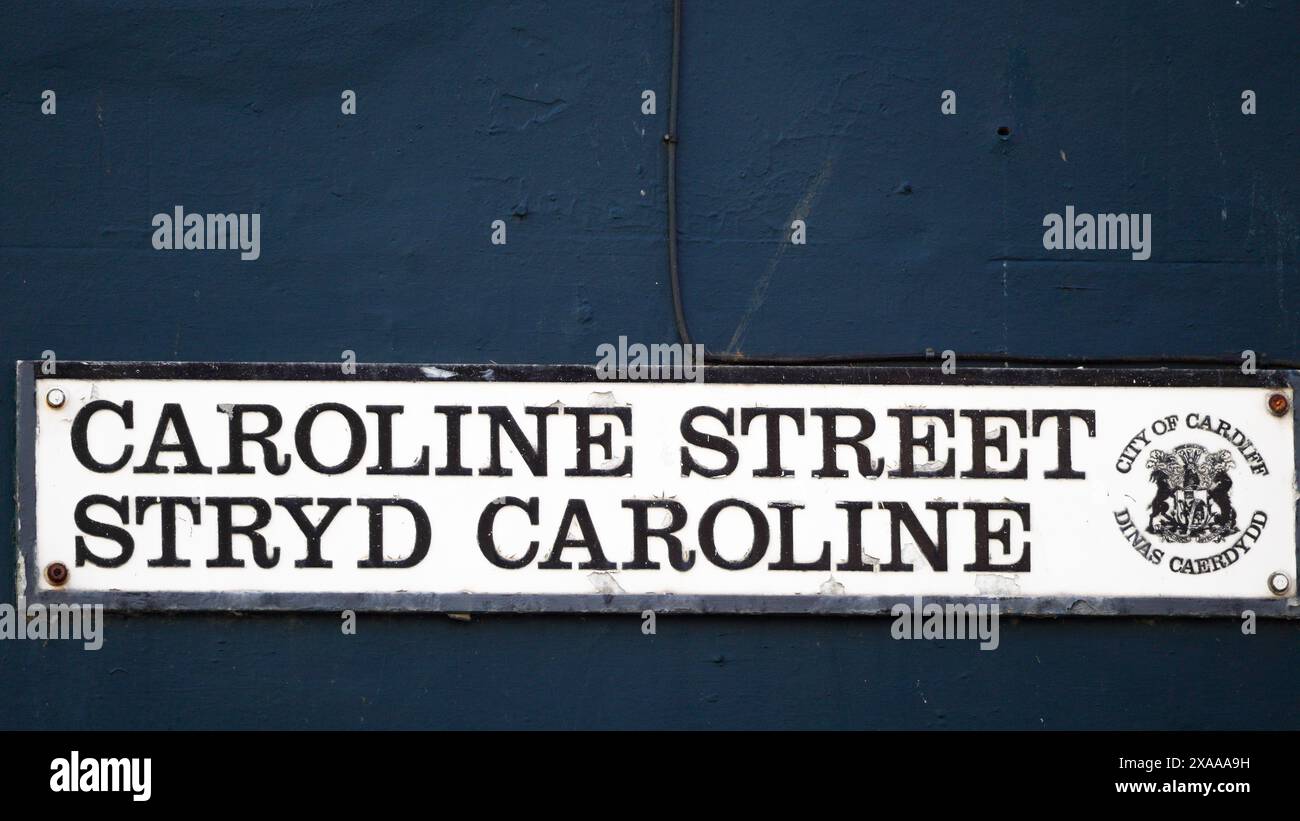 Cardiff, Wales Oct 29 2023: Caroline Street sign on red brick. Also ...
