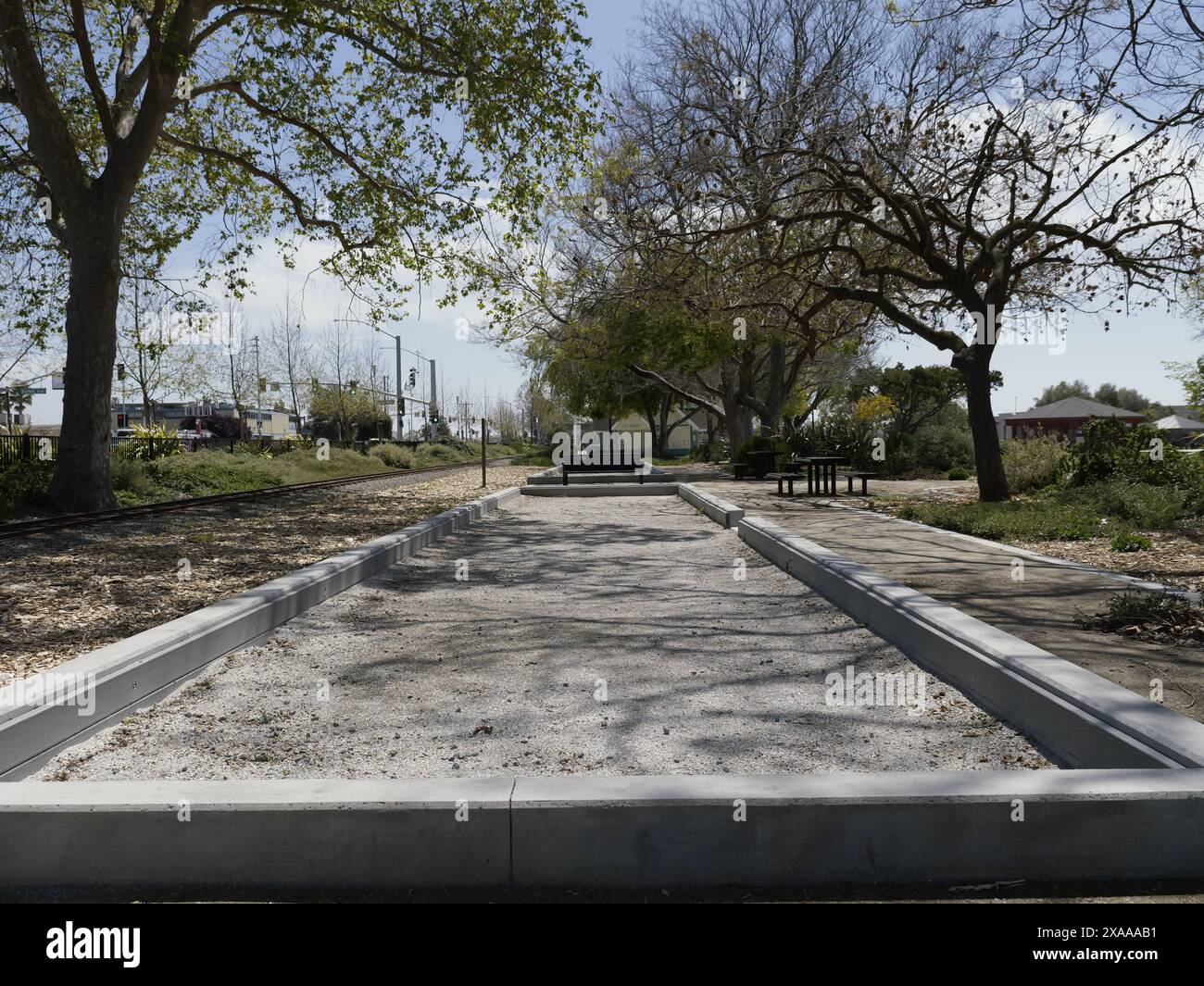 A park bench in a sandy pit Stock Photo - Alamy
