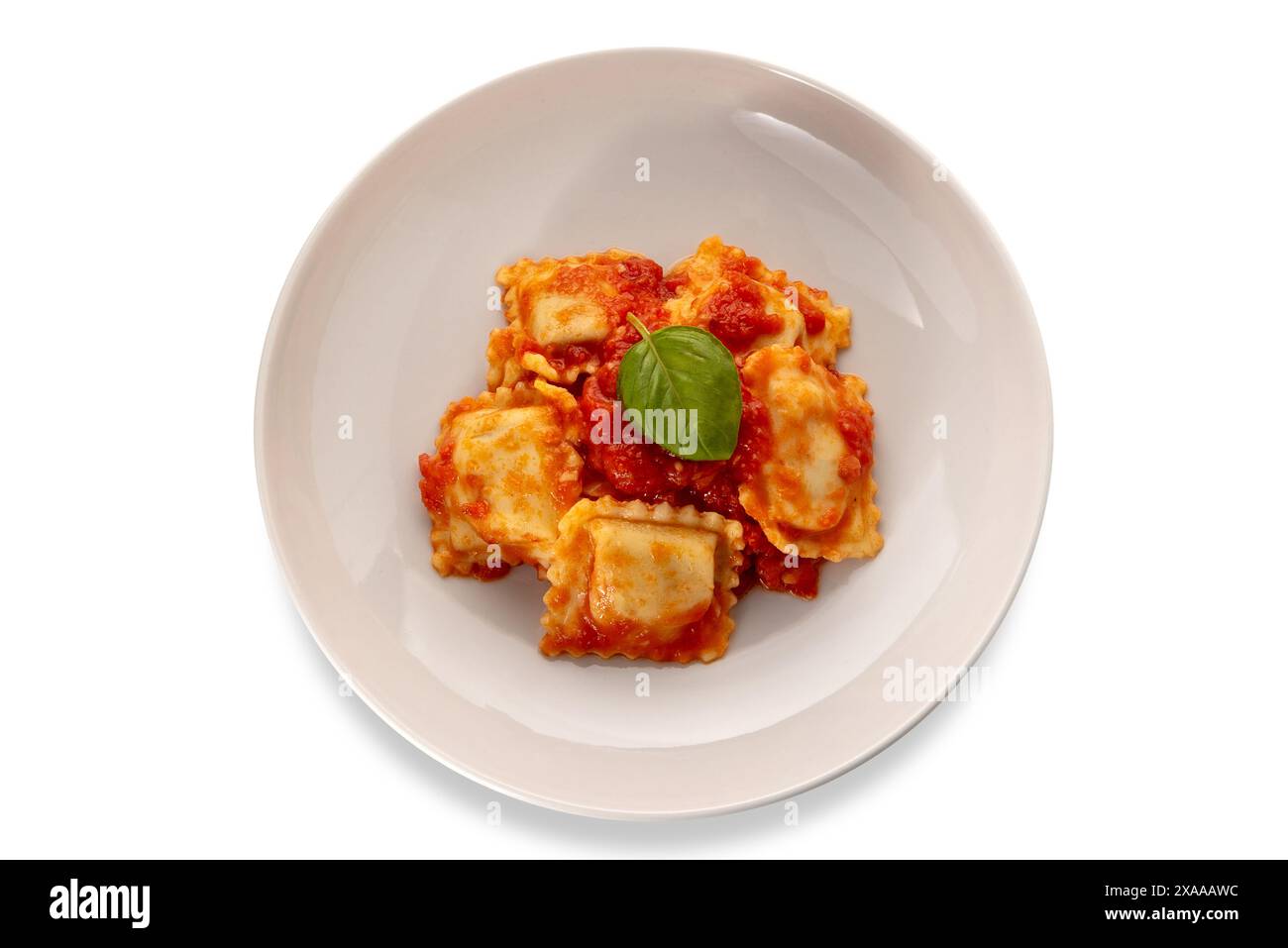 Ravioli with tomato sauce and basil leaf in white plate isolated on ...