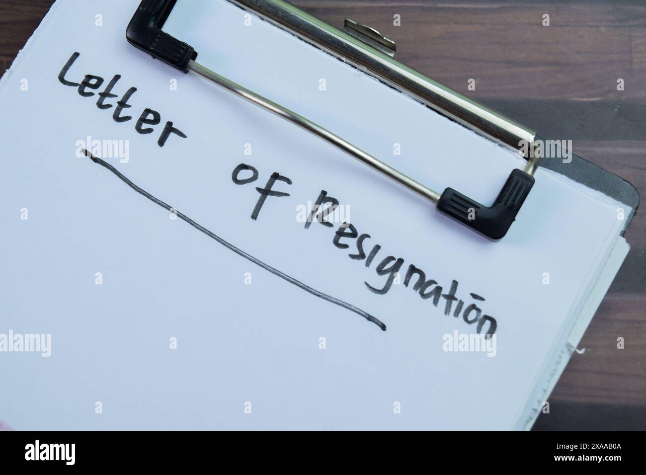 Concept of Letter of Resignation write on paperwork isolated on wooden ...