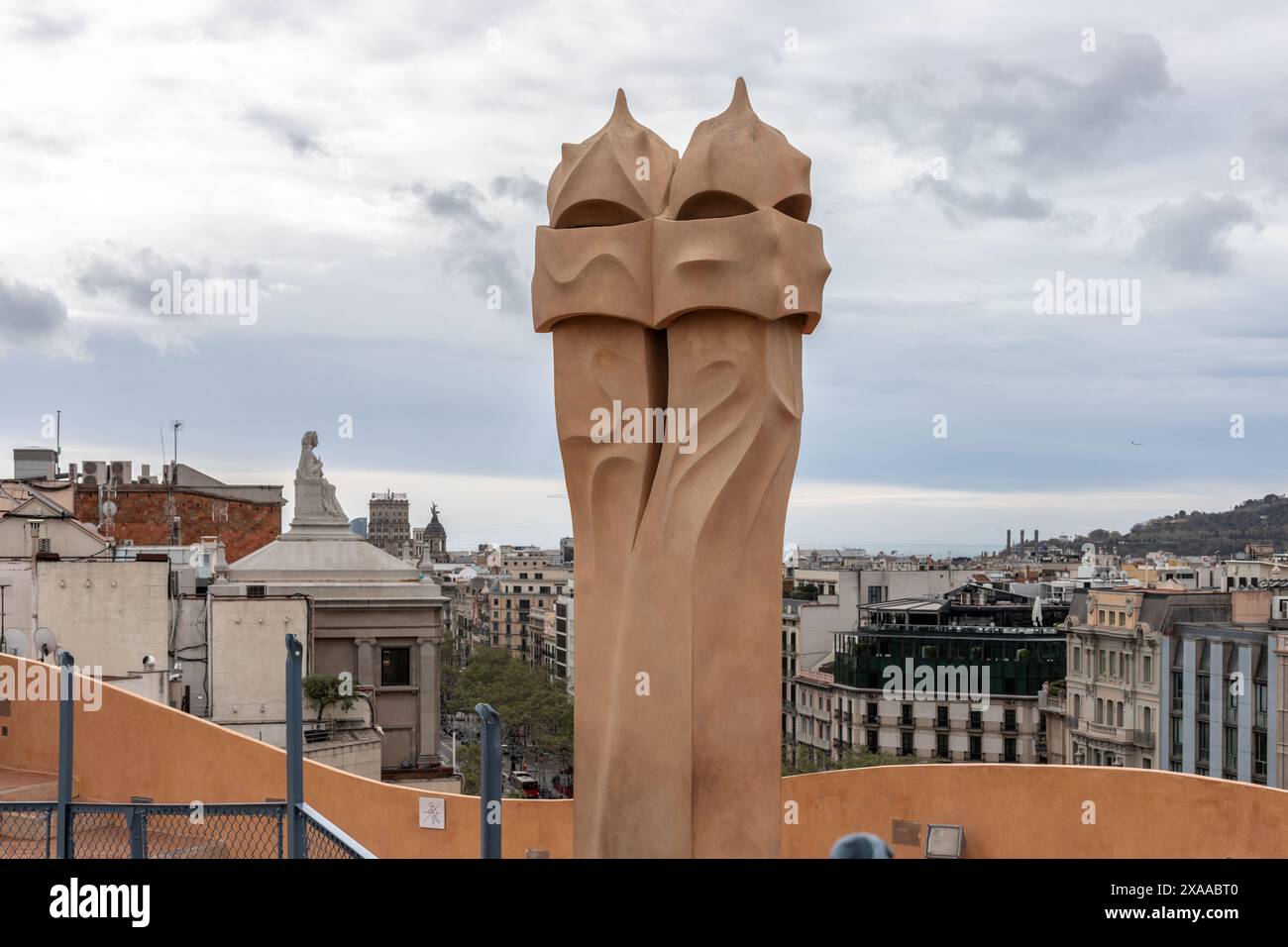 A miniature sculpture perched on a rooftop, gazing at a cityscape Stock ...