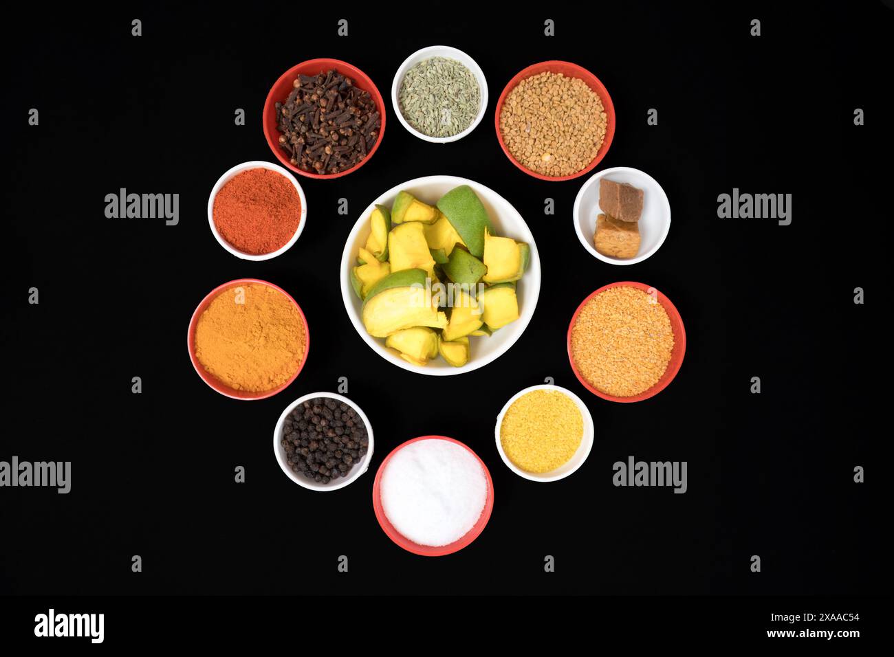 slices of mongo with different type of spices filled in bowls in ...