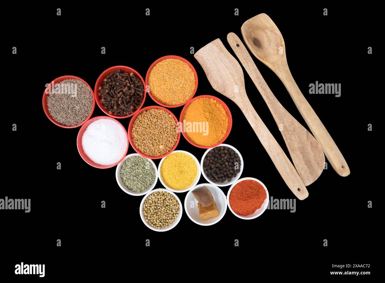 three wooden spatulas with Cumin Seeds, Clove, Yellow Split Mustard ...