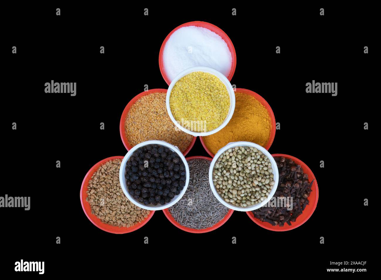 red bowls filled with salt, Fenugreek Seeds, turmeric powder, Mustard ...