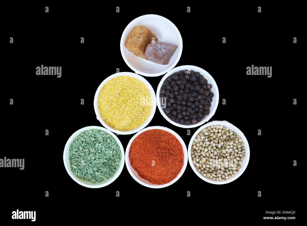 small white bowls filled with Asafoetida, Yellow Split Mustard Seeds ...